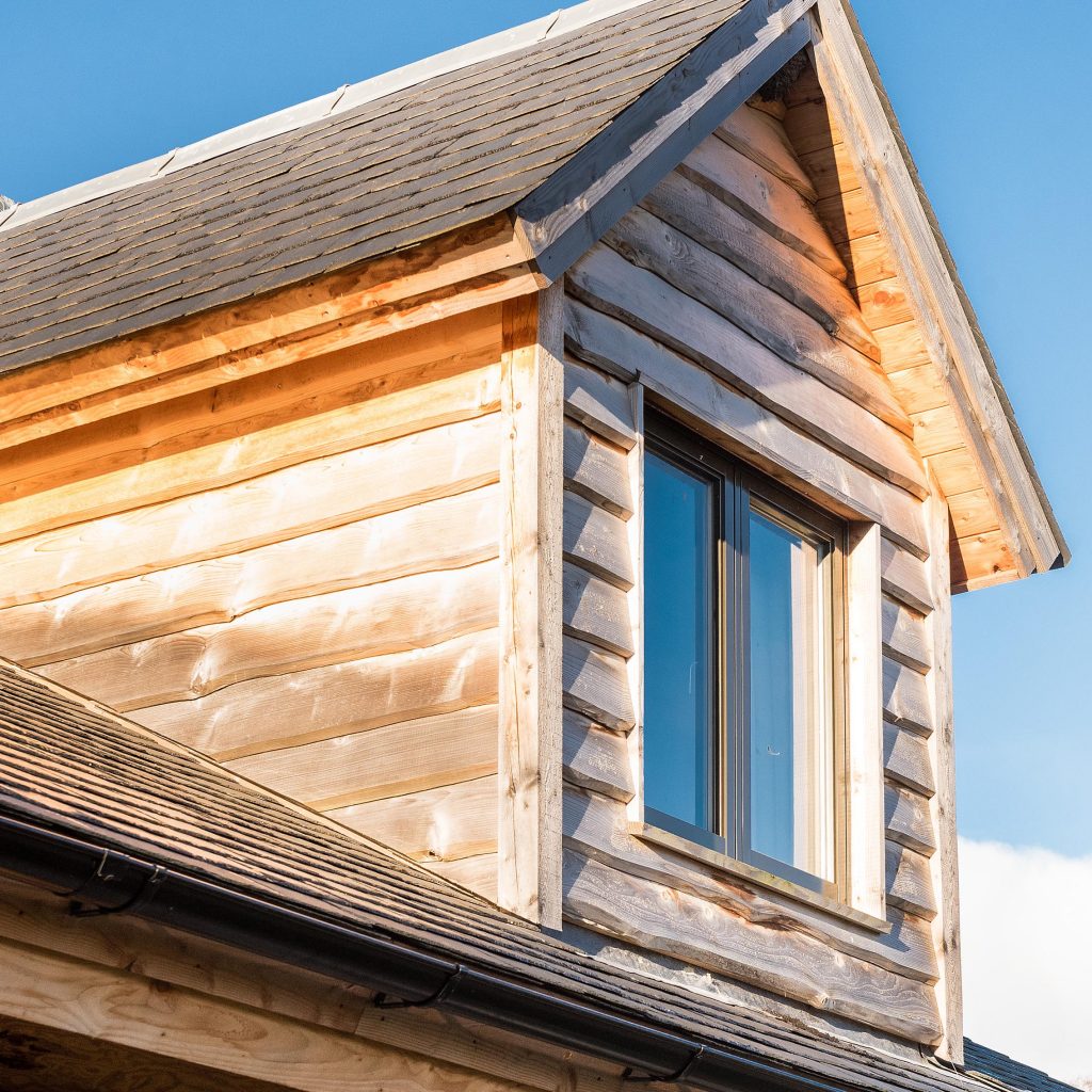 waney edge cladding project - Caledonia Log Homes